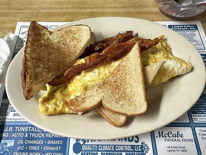 Behold the Western Omelette - where ham, peppers, and cheese unite in fluffy, golden perfection that dreams are made of.