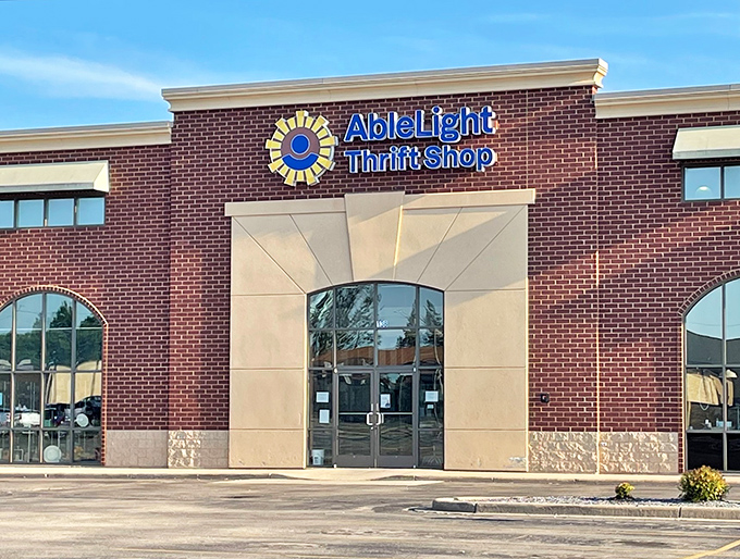 Brick and stone architecture houses a thrift shop with heart, where shopping becomes community building.