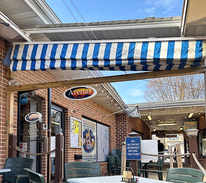 Arena's blue and white striped awning isn't just beach-town pretty—it's marking the spot where sandwich creativity meets vacation vibes in perfect harmony.