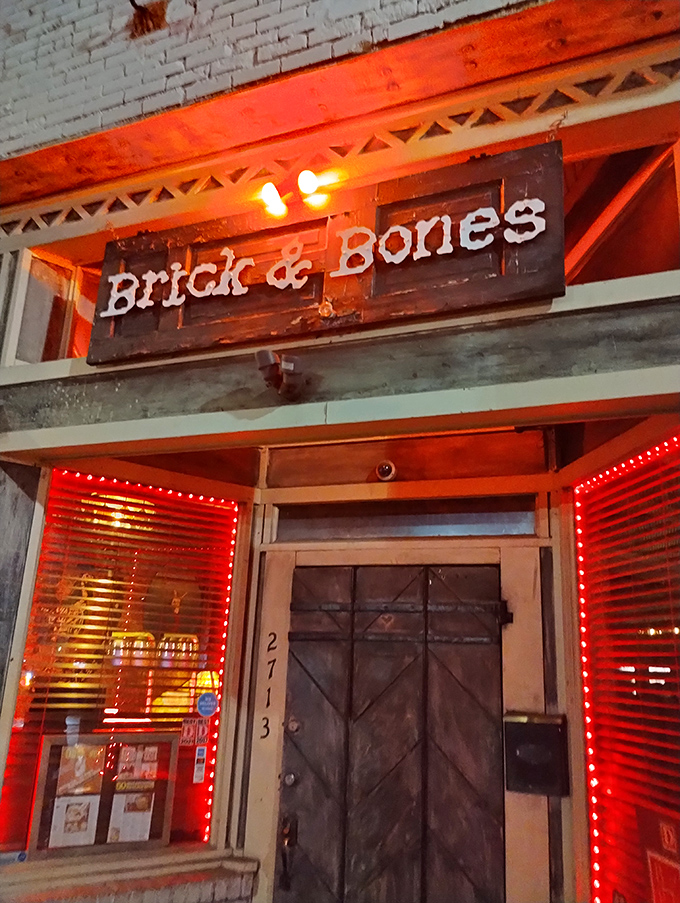 Brick & Bones entrance: That weathered door isn't keeping secrets&mdash;it's protecting some of Dallas' most crave-worthy chicken until you arrive.