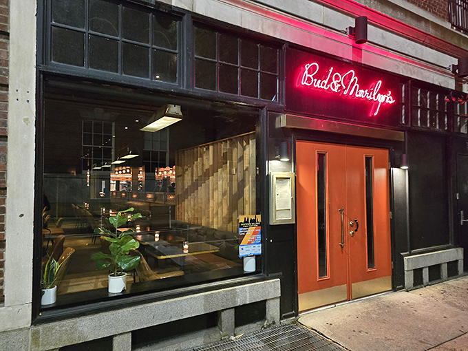 Bud & Marilyn's neon glow beckons like a lighthouse for the hungry. Inside, fried chicken dreams come true with cocktails to match.