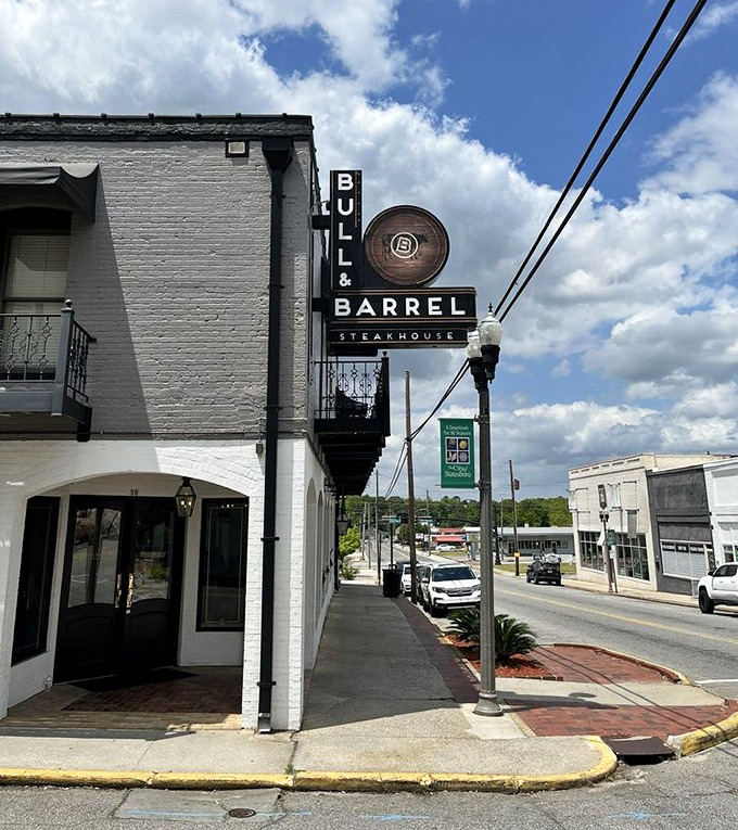 Bull and Barrel's sleek white exterior and modern signage bring a touch of urban sophistication to downtown Statesboro.