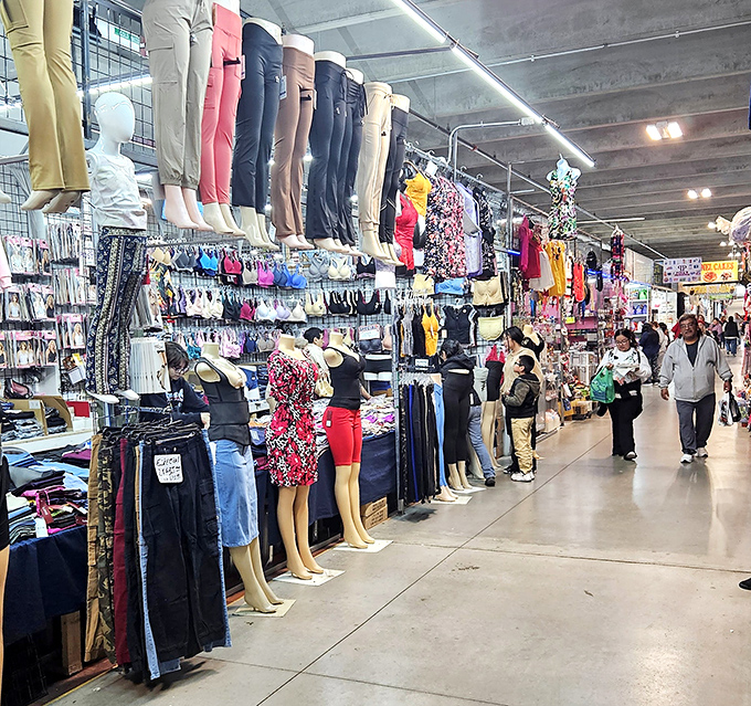 Clothing racks burst with colorful possibilities while shoppers navigate aisles of affordable fashion finds.