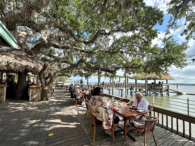 Cap's waterfront deck stretches over the water like an invitation to slow down and savor life, one oyster at a time. 