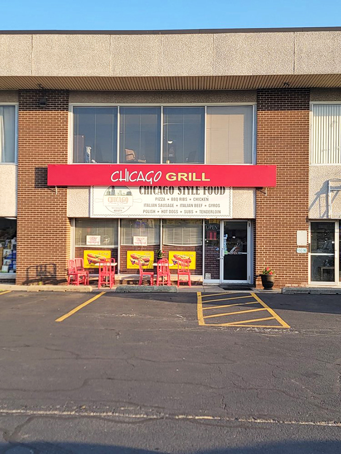 Red chairs outside signal good times ahead &ndash; like a pizza party waiting to happen.