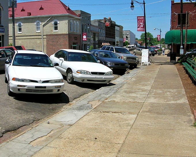 Corinth's sunny sidewalks invite leisurely strolls where your biggest worry is choosing which bench to rest.