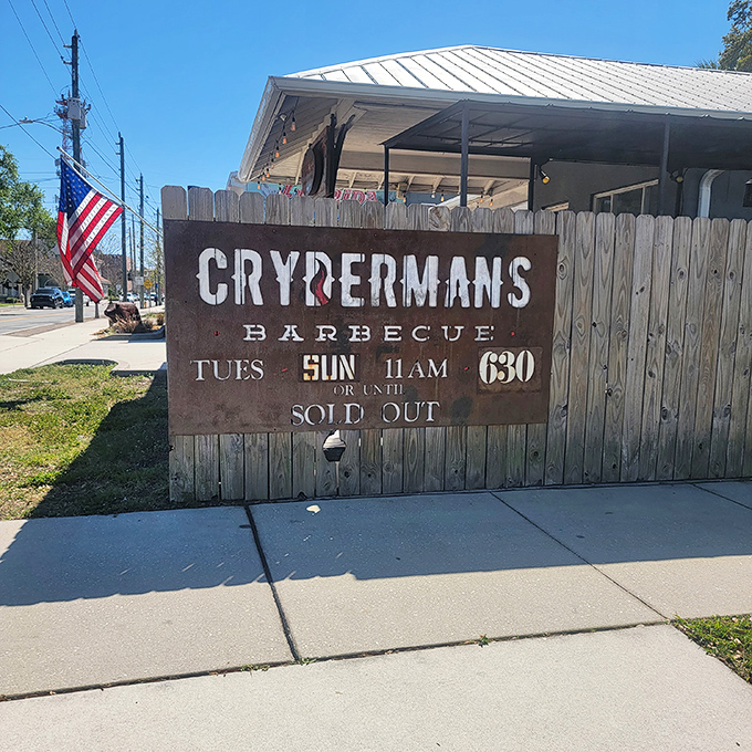 Behind that wooden fence lies barbecue magic, where patience and smoke create unforgettable flavors daily.