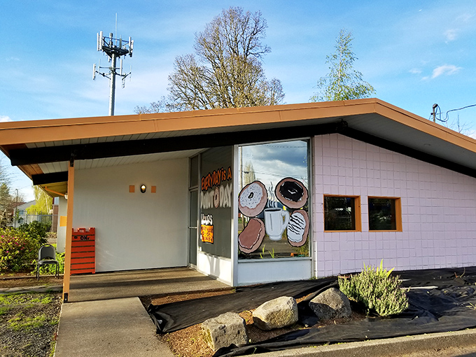 Donut Day's cheerful storefront proudly announces they serve bubble tea alongside their donuts. The colorful window art hints at the creative treats waiting inside.