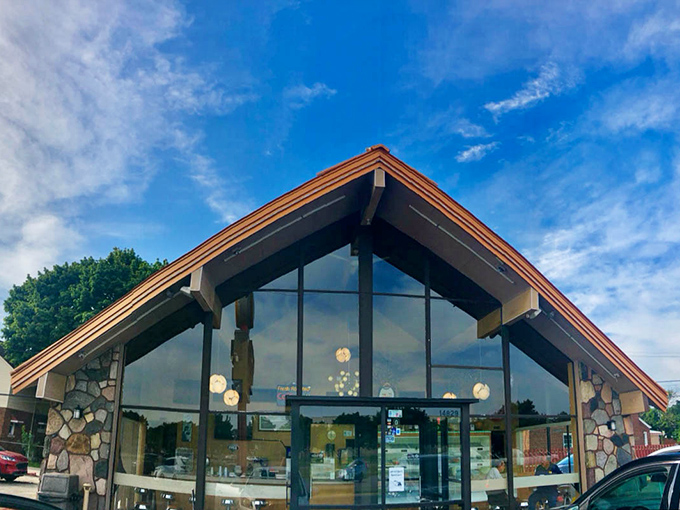 Modern glass and stone architecture housing old-fashioned donut magic &ndash; sometimes the best combinations come from unexpected contrasts.