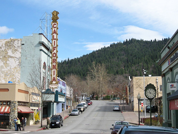 The California Theatre's neon promise beckons uphill, where Dunsmuir's mountain magic awaits beyond the final credits.