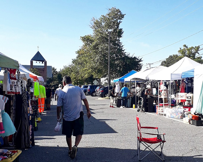 St. Mark's transforms asphalt into opportunity. Vendors line up their wares while shoppers prepare for the thrill of the hunt.