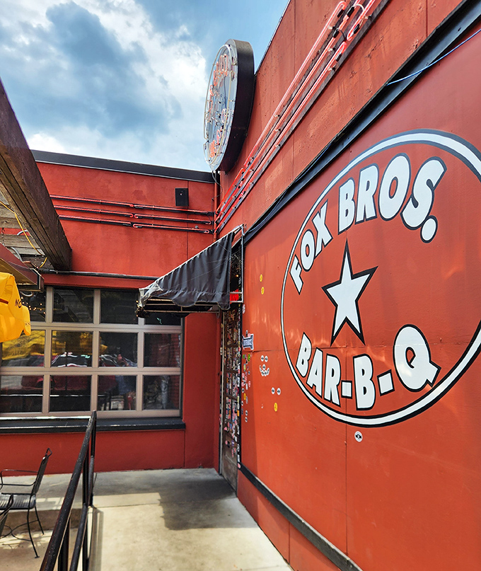 Bold red walls announce serious barbecue intentions like a beacon calling all rib lovers to smoky salvation.