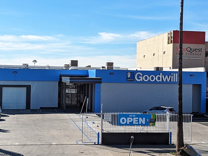 Goodwill's blue beacon calls bargain hunters like a lighthouse guides ships to safe harbor.