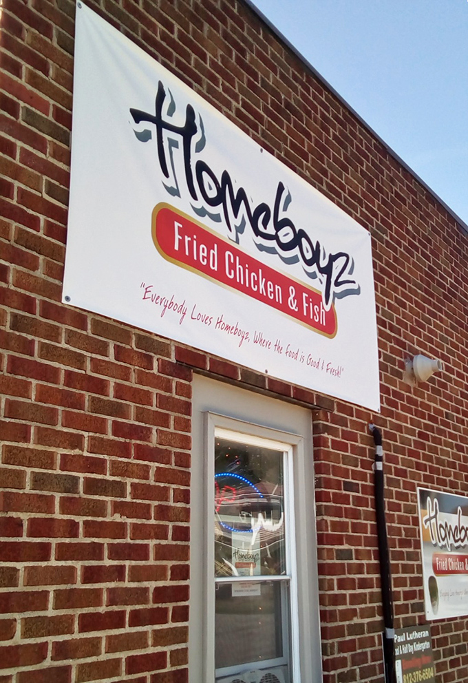 Homeboyz's brick storefront with that bright orange door is like a portal to fried chicken heaven. No password required!