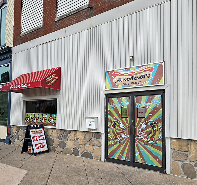 Hot Dog Eddy's psychedelic entrance is like a portal to flavor town. Those colorful doors promise hot dog adventures beyond your wildest dreams.