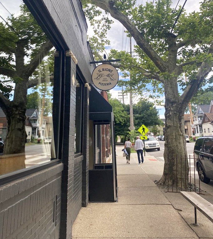 Modern meets traditional on this Cleveland street, where pizza artistry happens behind those sleek glass windows.