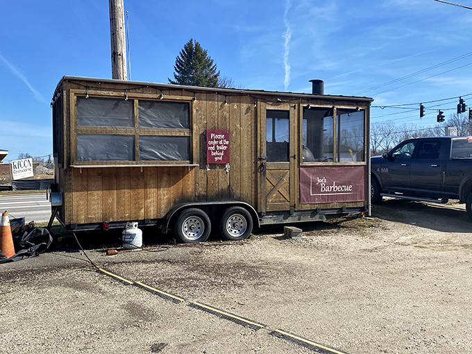 This wooden trailer proves that great brisket doesn't need a permanent address to find you.