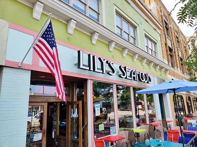 Lily's colorful facade practically vibrates with the promise of fresh catches and ice-cold brews waiting inside.