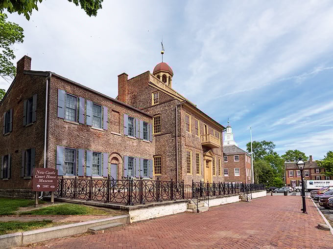 New Castle's courthouse dome catches sunlight like a beacon, guiding visitors through centuries of perfectly preserved American history.
