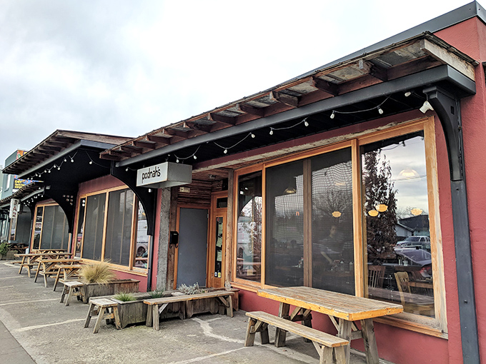 Those welcoming picnic tables and warm lighting create the perfect setting for serious barbecue conversations with good friends.