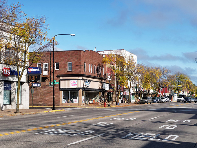 Autumn paints Main Street in warm hues while local businesses keep their doors open for unhurried browsing sessions.