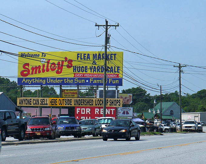 Smiley's yellow billboard brightens the roadside like a beacon for bargain hunters. That happy face knows what treasures await inside!