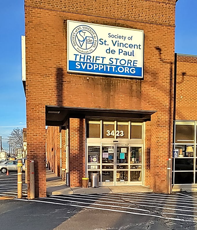 Sunlight catches the St. Vincent de Paul sign, guiding thrift enthusiasts to this Pittsburgh secondhand sanctuary.
