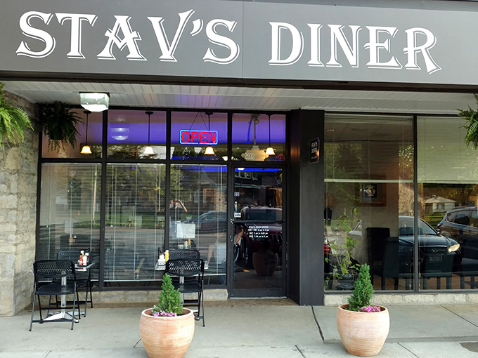 Modern meets timeless at this sleek spot where stone columns frame windows full of breakfast promises.