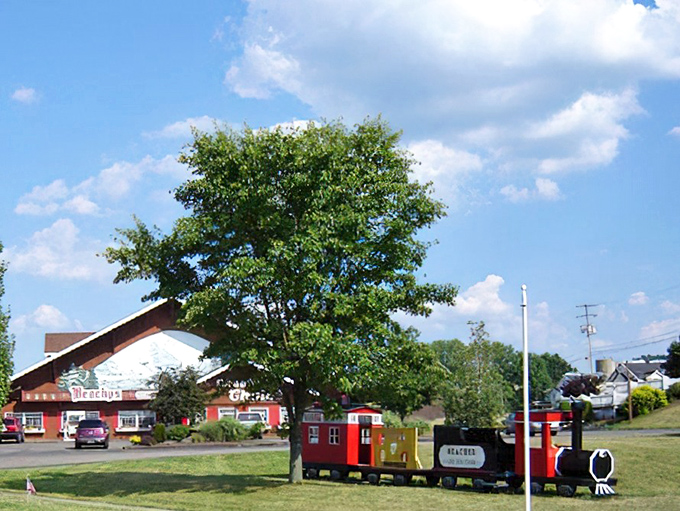 This little red caboose has seen more adventures than most folks, now resting in well-deserved retirement.