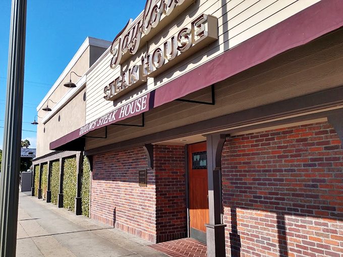 Taylor's brick exterior hints at the old-school steakhouse experience waiting inside &ndash; Mad Men vibes with modern-day flavor.