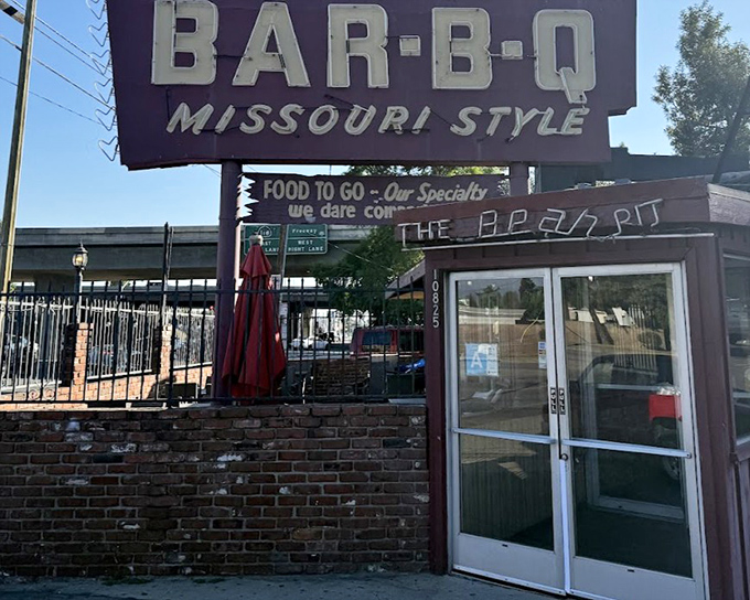 The Bear Pit's rustic charm whispers "real BBQ lives here" to hungry souls.