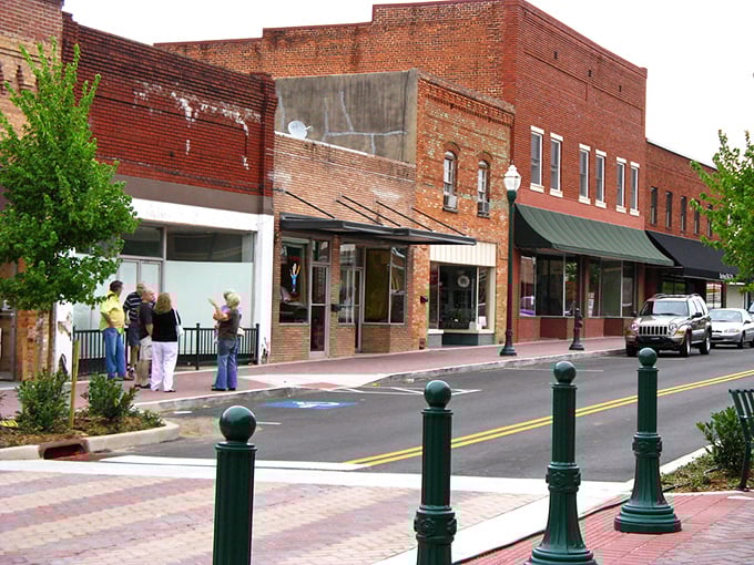 Small-town perfection where the buildings lean in close like old friends sharing secrets over coffee. 
