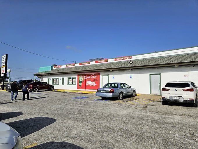 West Side Cafe's green awning and brick exterior scream "authentic diner" louder than a rooster at sunrise.