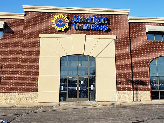 That cheerful storefront proves thrift shopping doesn't have to feel like diving through someone else's forgotten basement treasures.