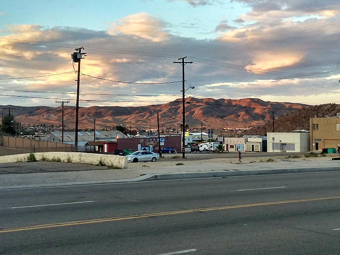 Desert mountains frame this highway town like a postcard from America's golden age of road trips.