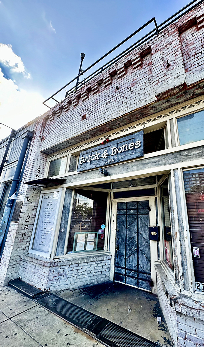 Brick & Bones exterior: White brick, wooden door, and chicken that makes you question everything you thought you knew about fried poultry.