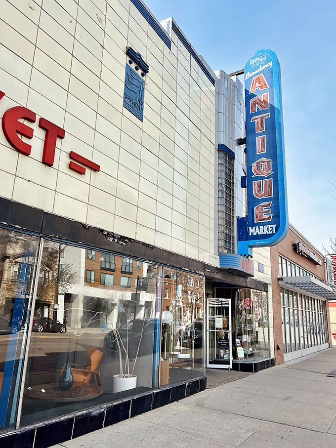 That blue neon "ANTIQUE" sign isn't just advertising&mdash;it's a beacon for design lovers seeking mid-century modern magic.