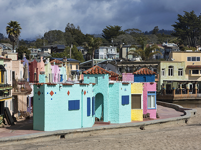 These vibrant Venetian Court cottages sit so close to the waves you could surf from bed.