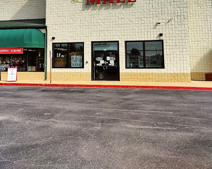 The mall's entrance beckons like a portal to the past where memories and bargains wait patiently for discovery.