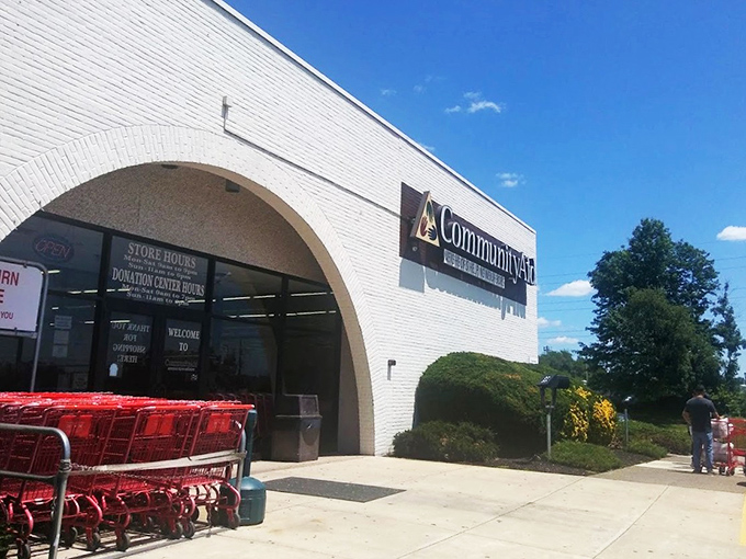 Bright and welcoming, Community Aid invites shoppers into its treasure-filled halls. The parking spots hint at the adventures waiting inside.