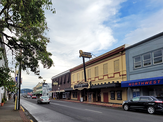 Downtown charm! Coos Bay's historic theater and local shops line the streets, inviting visitors to explore its vibrant community vibe.