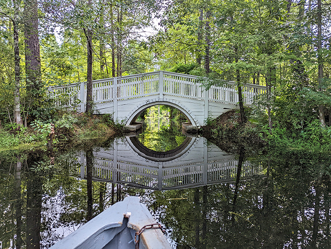 Circle of serenity! This white bridge creates a perfect O of tranquility&mdash;like Mother Nature's zen meditation symbol floating on black-water glass.