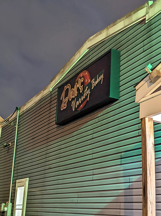 That green siding holds decades of donut dreams and sugar-powered morning conversations inside.