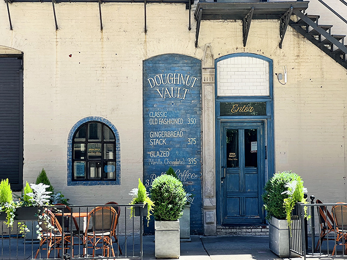Old-world charm meets modern donut mastery. Doughnut Vault's beautiful blue fa&ccedil;ade and hand-painted menu board transport you to simpler times.