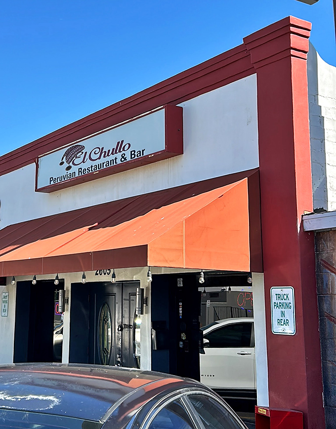 Those warm earth tones and simple storefront promise authentic flavors that transport you to Lima's coast.