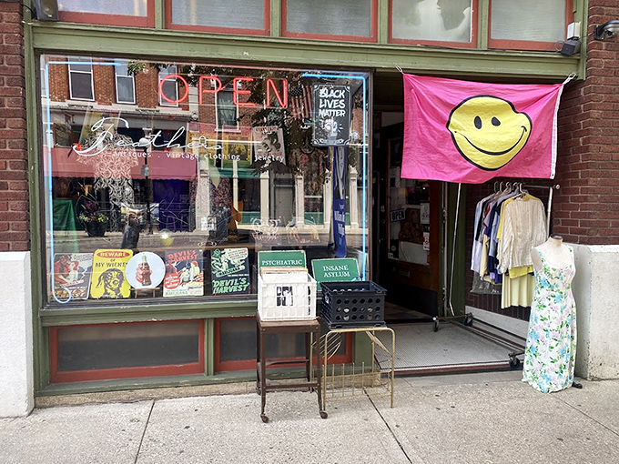 The cheerful yellow smiley flag says it all&mdash;Feathers is where vintage fashion goes to make new friends and find happy homes.