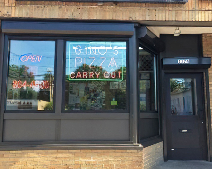 Behind those modest windows, pizza magic happens one perfectly crafted pie at a time.