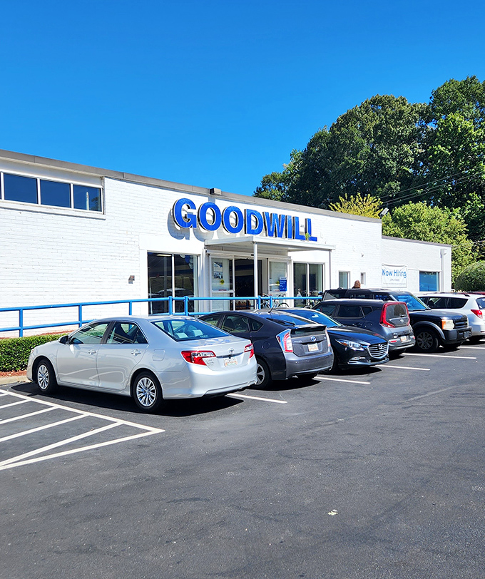 Goodwill's clean white exterior hides a kaleidoscope of possibilities inside. Those blue railings practically usher you in!