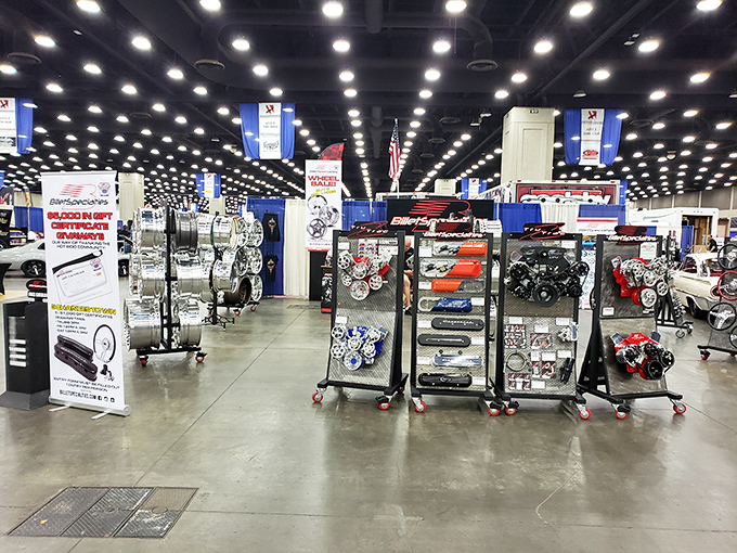 Displays of automotive parts gleam under bright lights. Even non-gearheads can appreciate this mechanical jewelry exhibition!