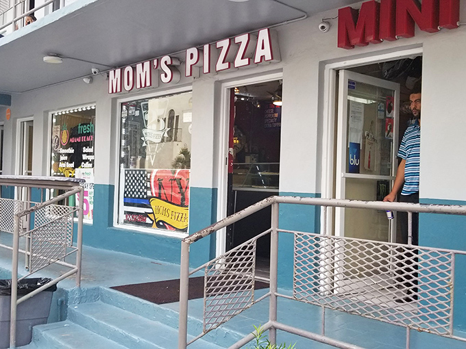 The blue and white façade might be simple, but inside lies pizza that would make a homesick New Yorker weep with joy.